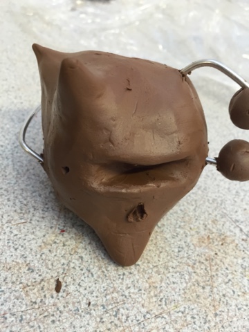 Ew, Ya nasteh: Surreal clay sculpture into mod rock sculpture