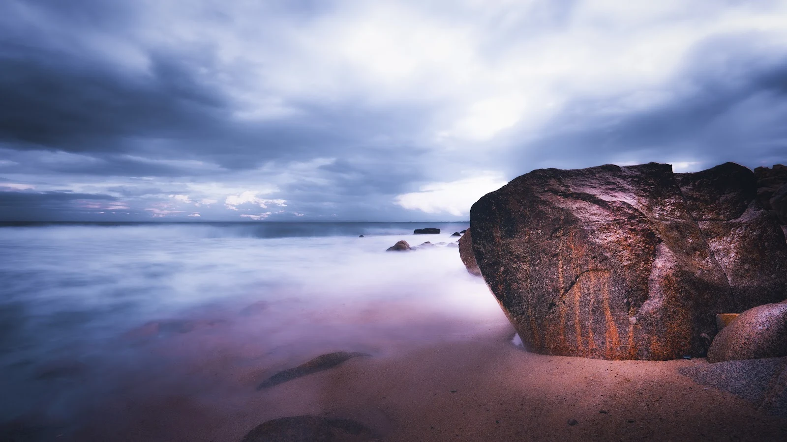 Dark Rocks On A Misty Shore 5K Desktop Wallpaper